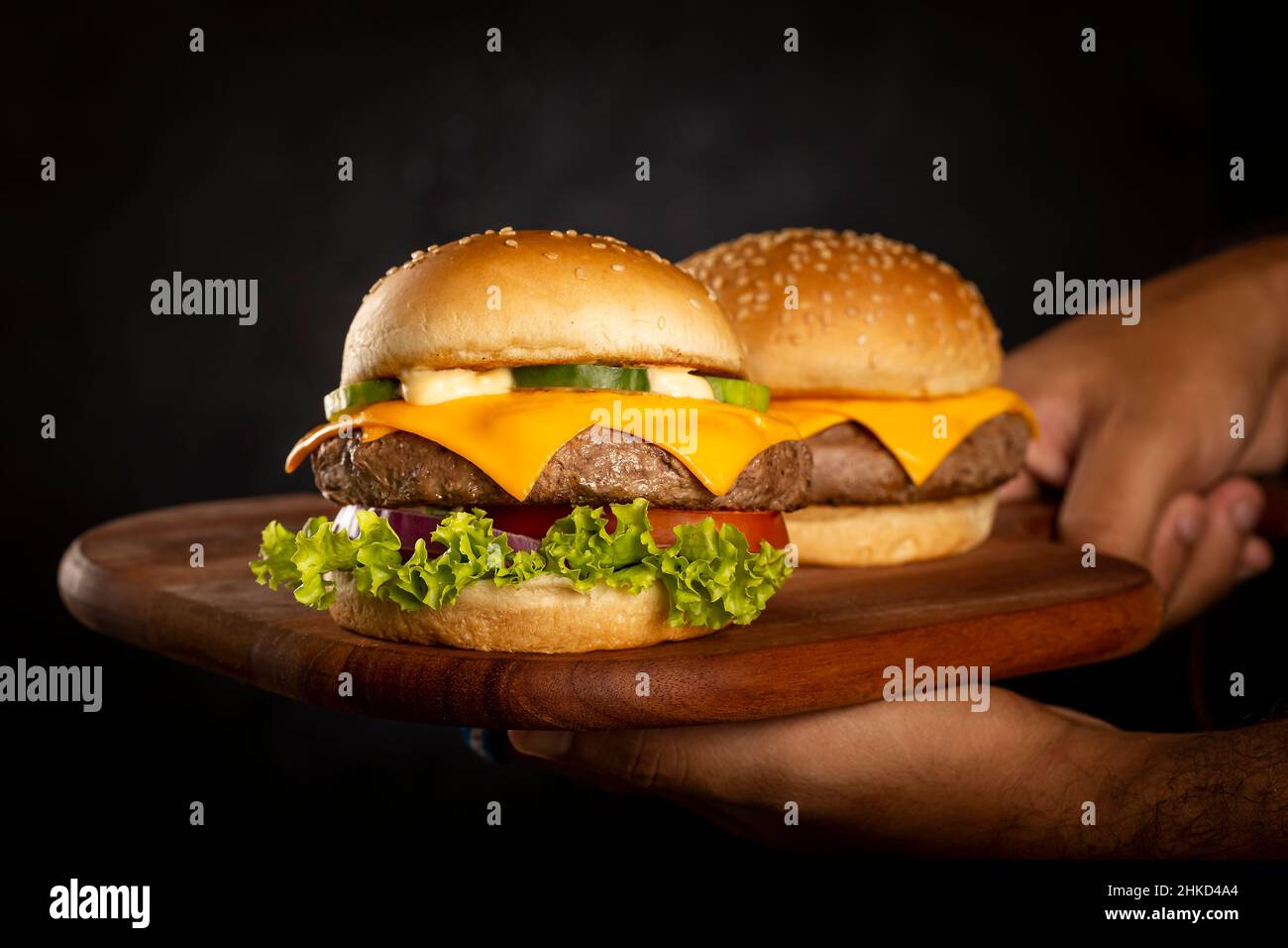 Hand holding grilled cheese sandwich hi-res stock photography and ...