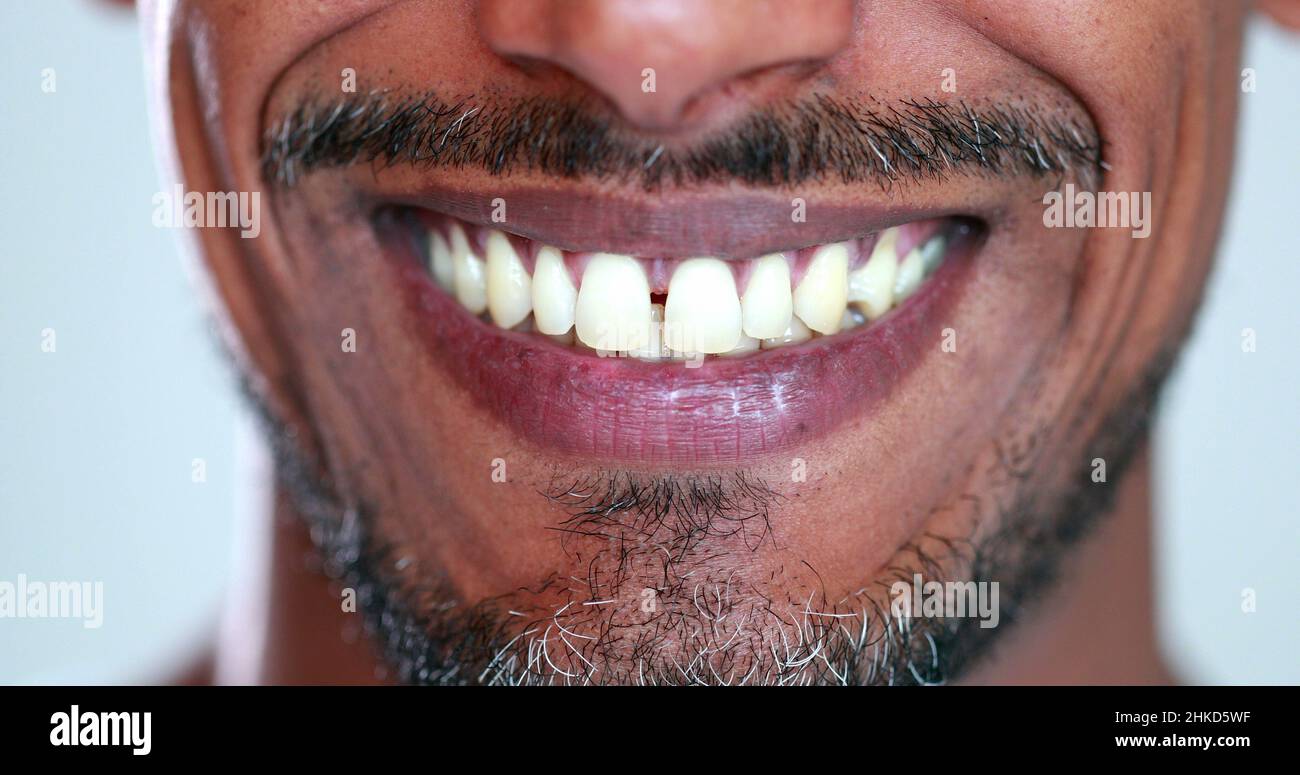 African American man smiling close-up mouth. Happy person feeling joy ...