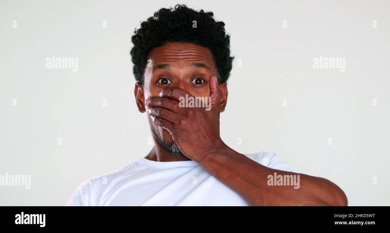 African american gradual shock reaction, face emotion black guy reacting with horror putting ...