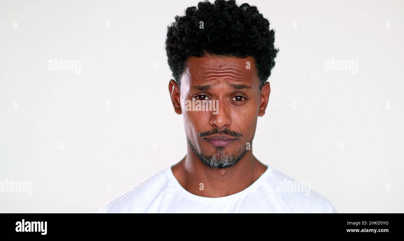 African man changing moods from surprised to relief smiling Stock Photo ...