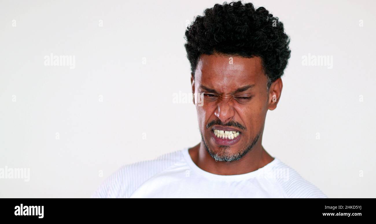 Shocked emotional unhappy african hi-res stock photography and images - Alamy