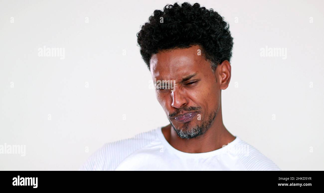African man disgust face reaction. Black guy feeling dislike Stock ...
