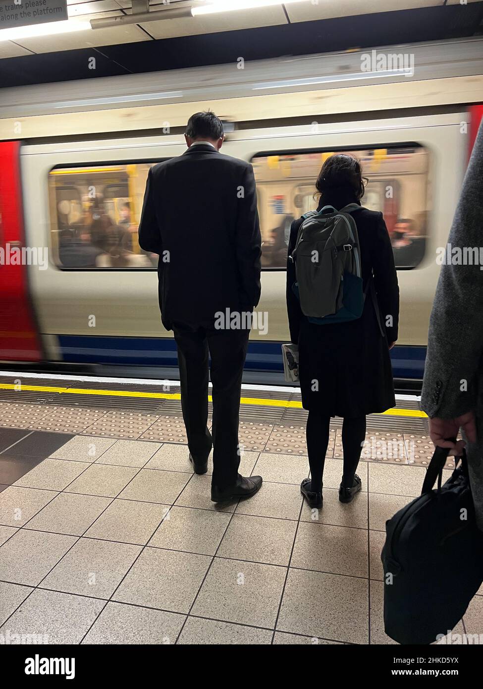 Commuters returning to their offices in London, waiting to board the ...