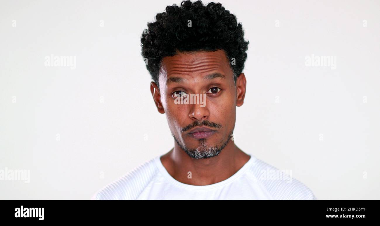 African man changing moods from surprised to relief smiling Stock Photo ...