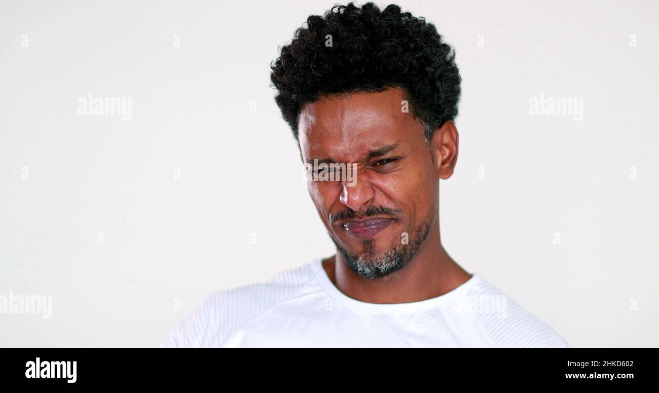 African man disgust face reaction. Black guy feeling dislike Stock ...