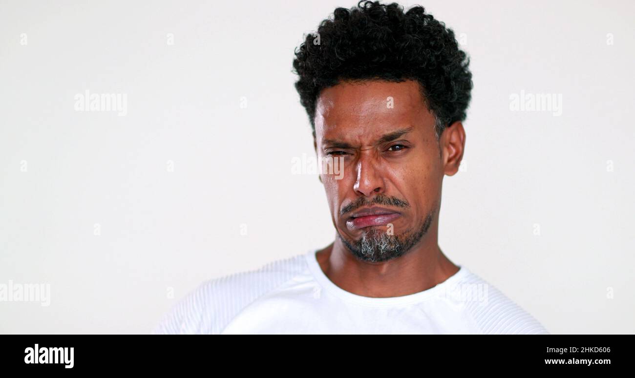 African man disgust face reaction. Black guy feeling dislike Stock ...