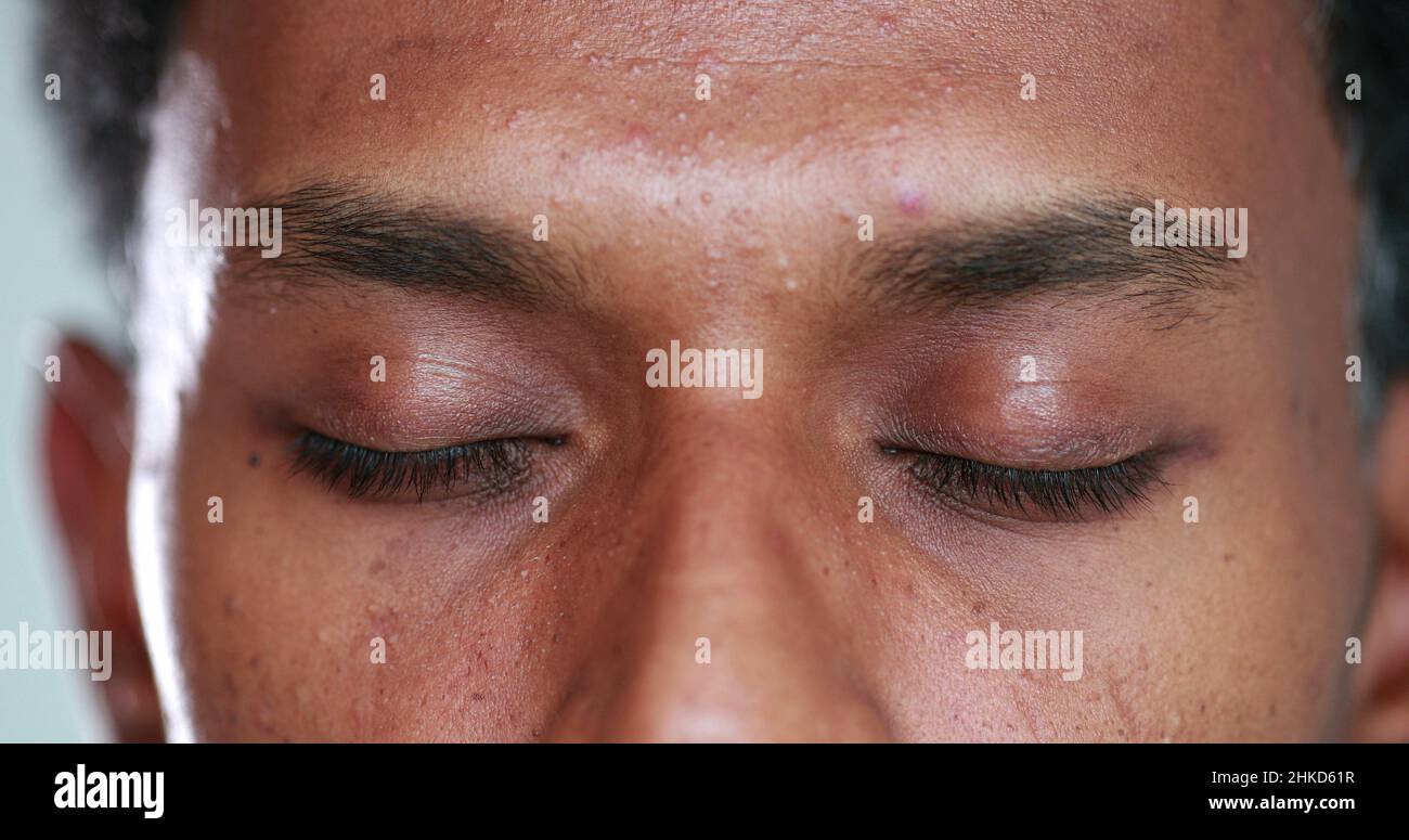 African man eyes close-up looking to camera smiling Stock Photo - Alamy