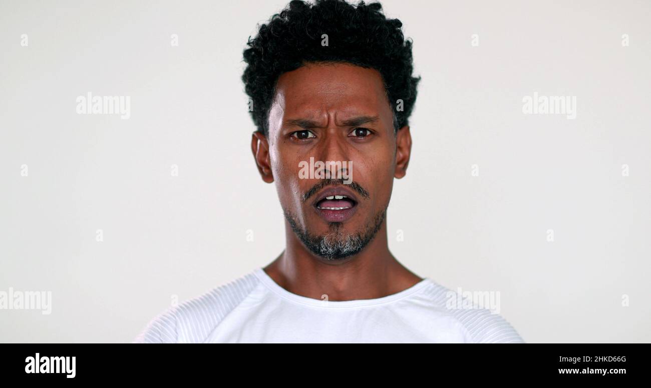 African man reacting shock surprise tense reaction face emotion Stock ...