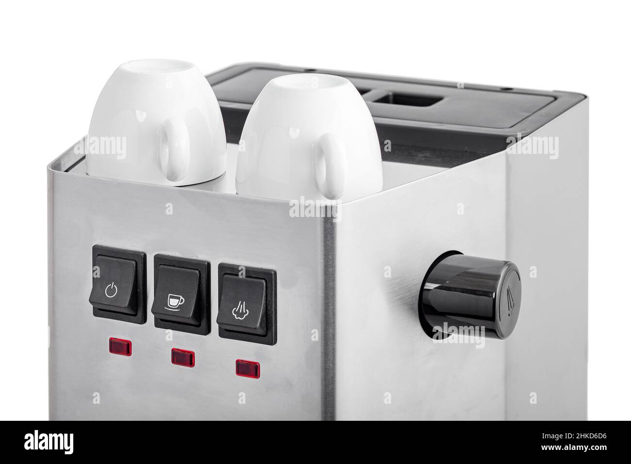 ceramic white espresso cups stand on top of a professional warming ...