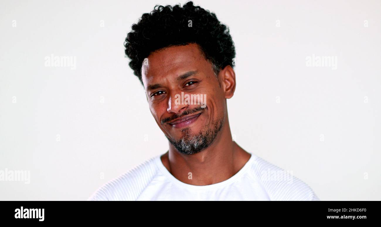 Casual black guy smiling to camera Stock Photo - Alamy