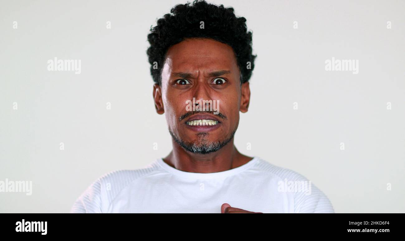 Black man reacting with SHOCK and TERROR to bad news Stock Photo - Alamy