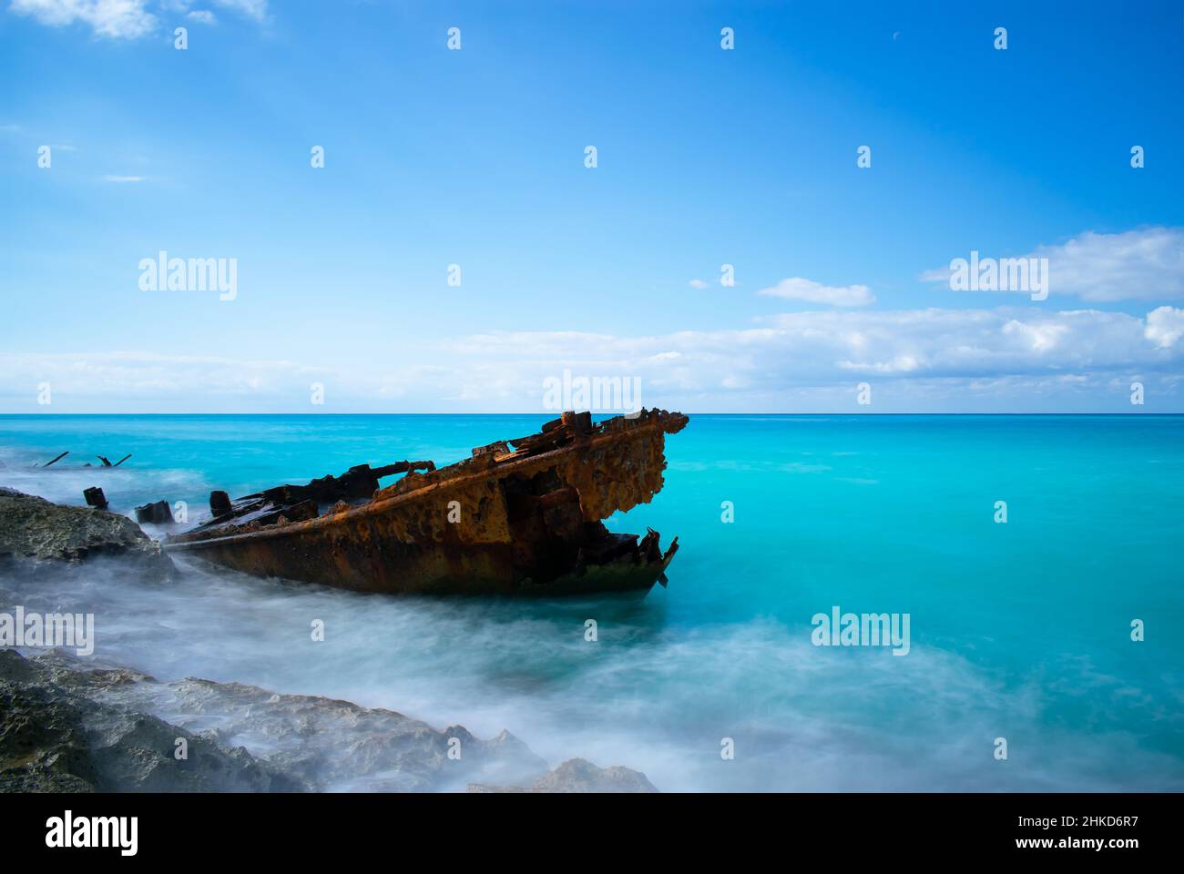 A long exposure shot of waves breaking around the bow and hull of The ...