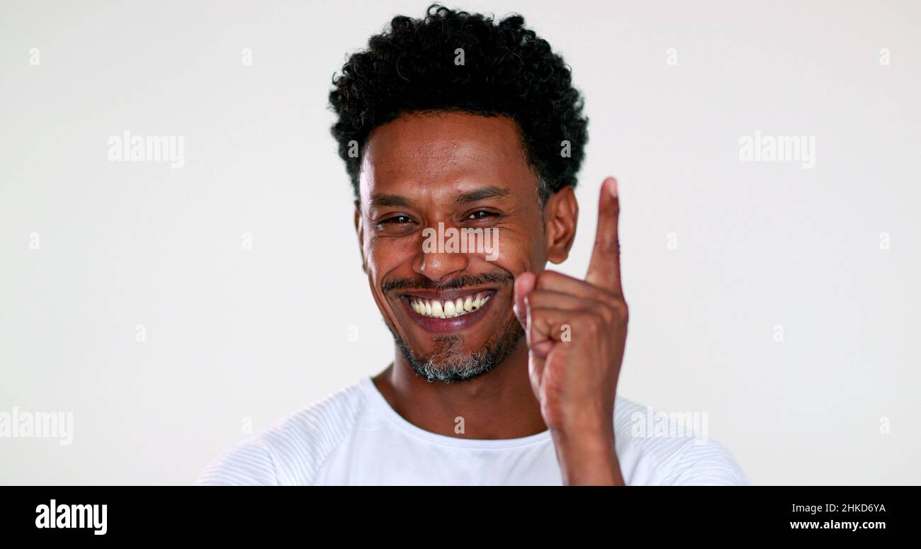 Happy African man having an idea celebrating creative solution. Man ...