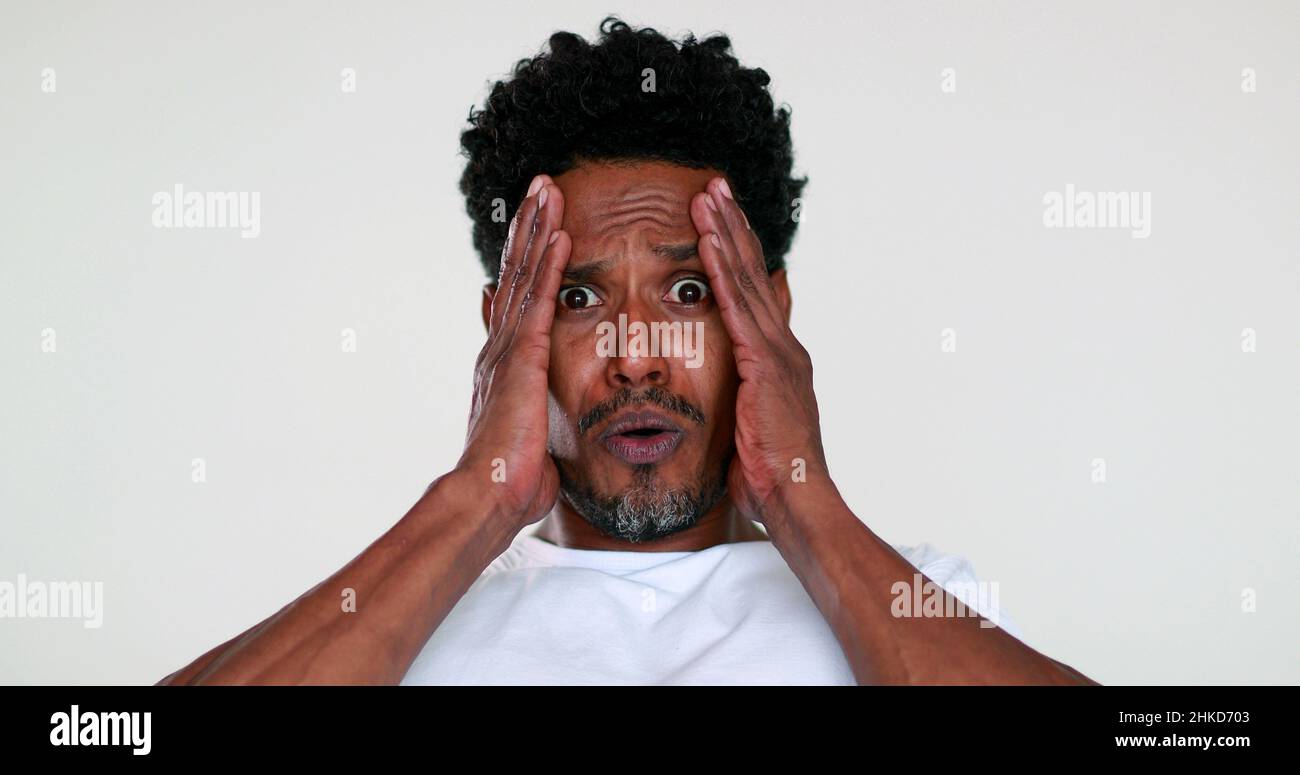 Man reaction with horror and terror looking to camera emotional fright ...