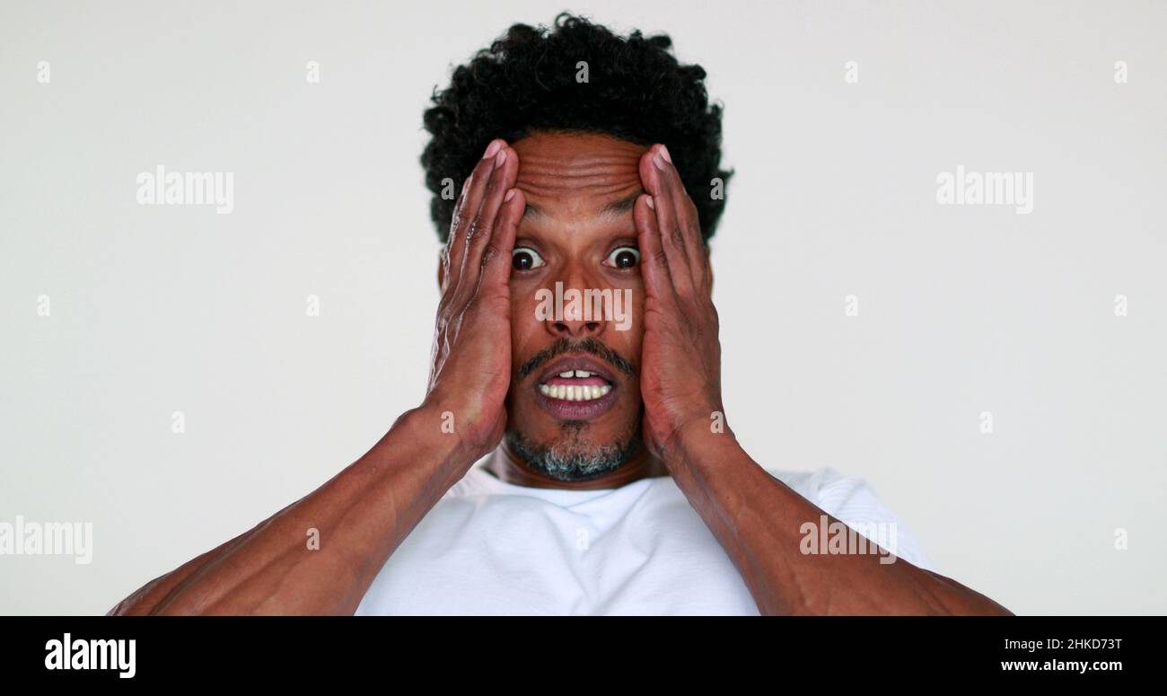 Man reaction with horror and terror looking to camera emotional fright ...