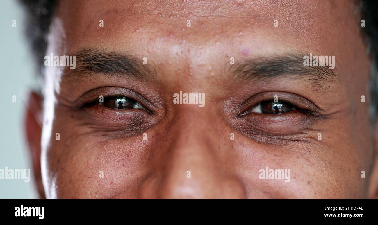 Mixed race african man eyes closeup smiling macro eyelid Stock Photo ...