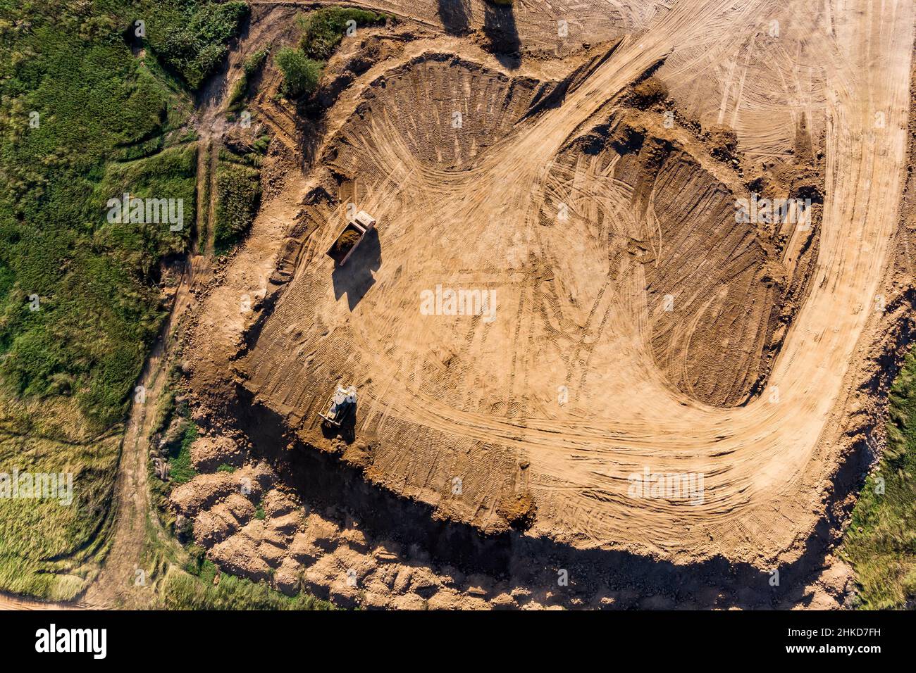 Removal of overburden on a piece of land before sand pit mining, aerial ...