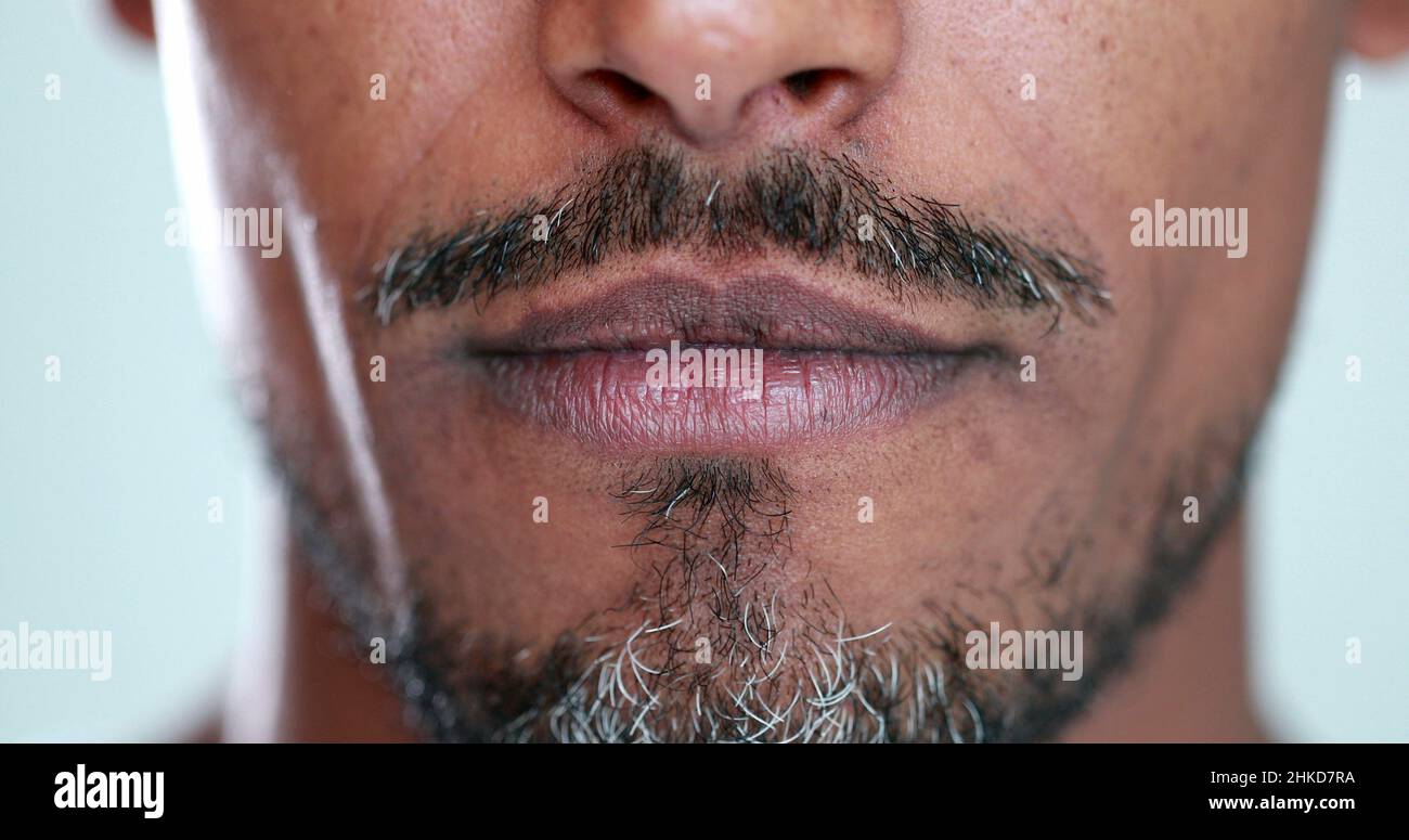 Person pressing lips close-up, man face mouth, lips pressed, facial ...