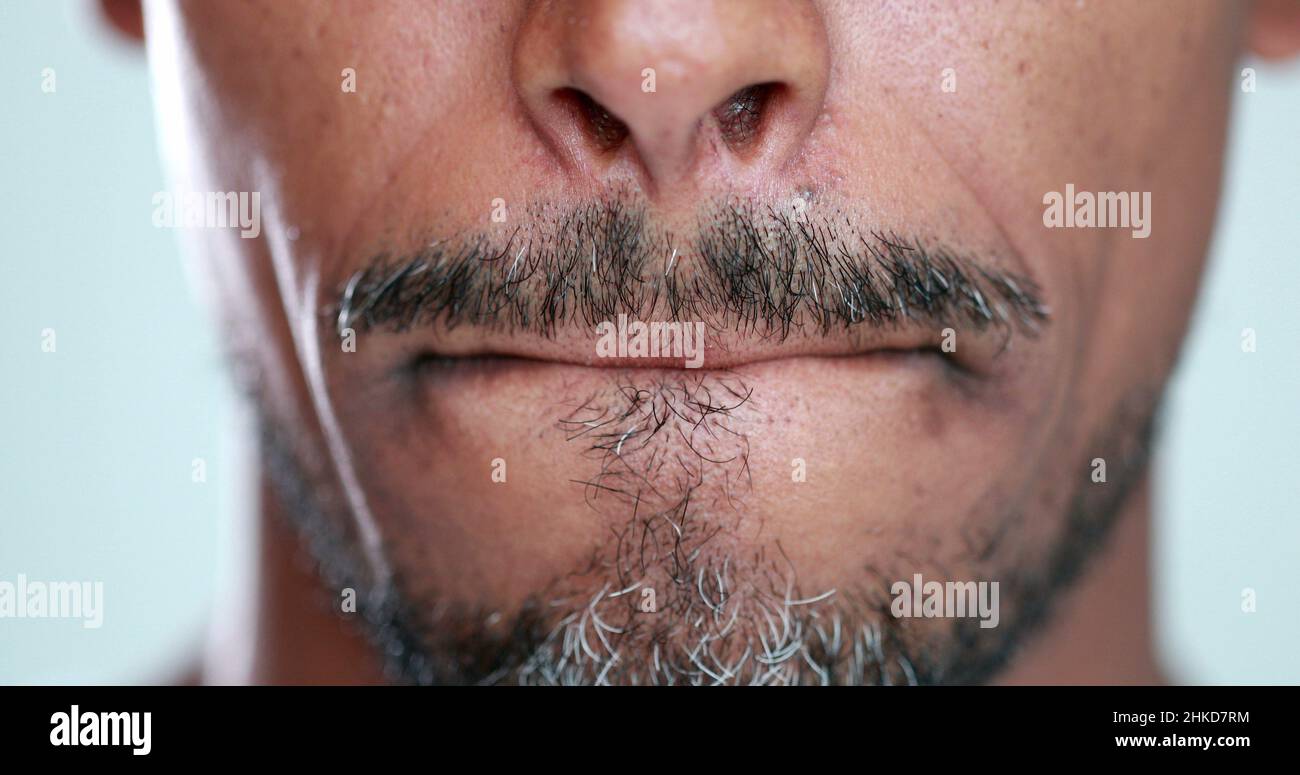 Person pressing lips close-up, man face mouth, lips pressed, facial ...