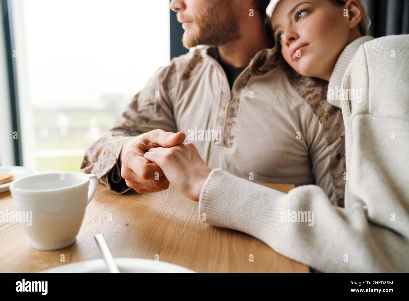 Beautiful romantic couple hugging and holding hands together while ...