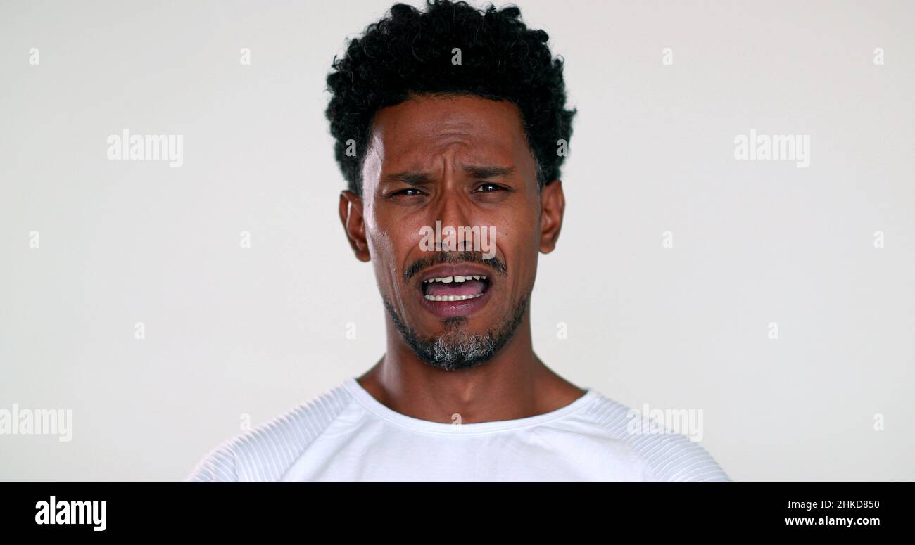 Shock reaction with terror horror and surprise to camera. Black african ...