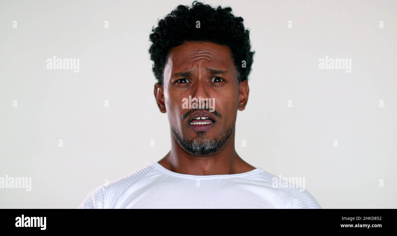 Shock reaction with terror horror and surprise to camera. Black african man portrait upset Stock ...