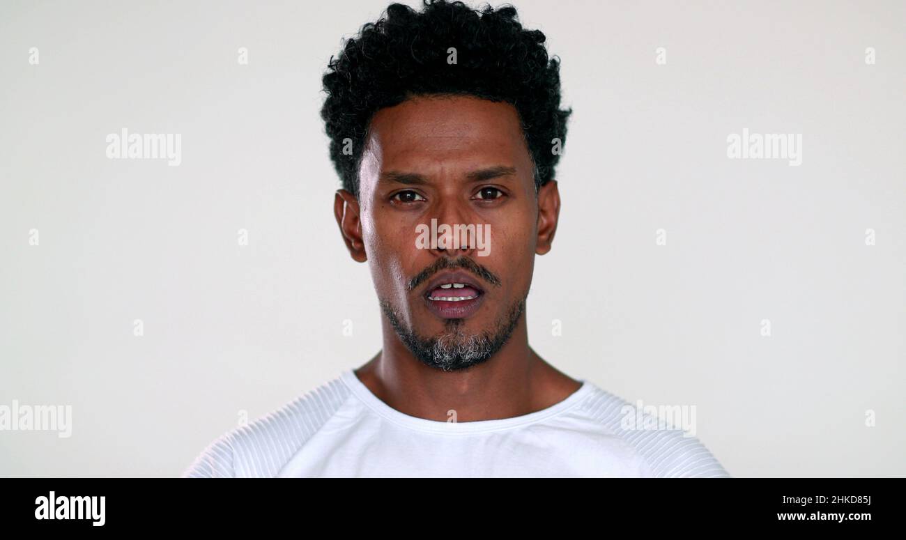 Shock reaction with terror horror and surprise to camera. Black african man portrait upset Stock ...