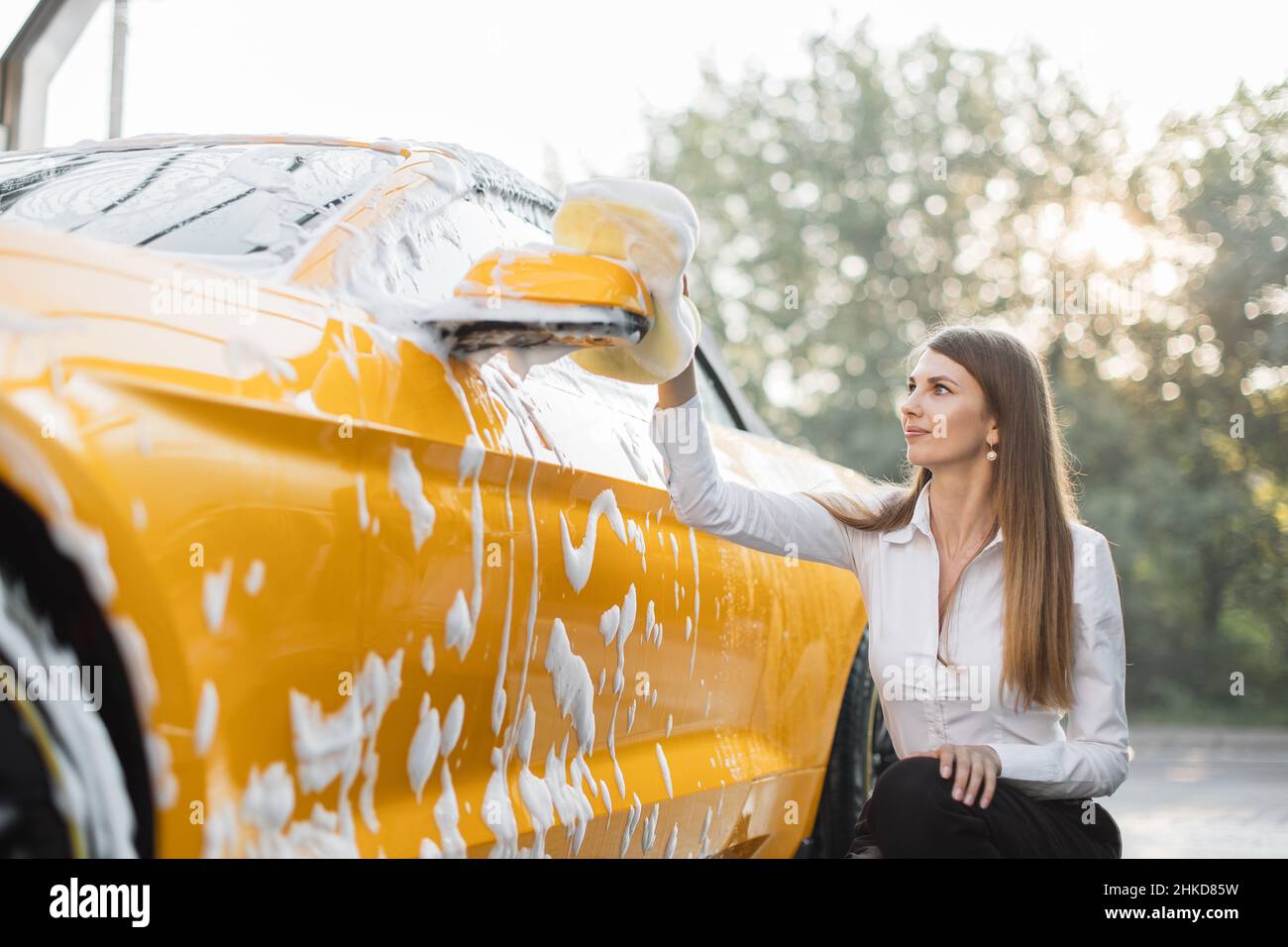 Business caucasian woman wearing on a white shirt and trousers washing ...