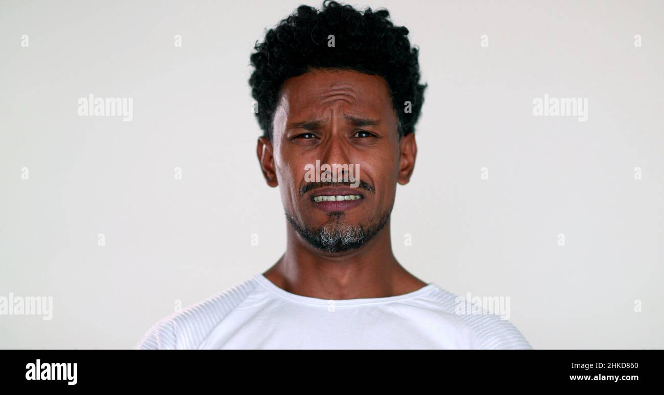 Shock reaction with terror horror and surprise to camera. Black african man portrait upset Stock ...