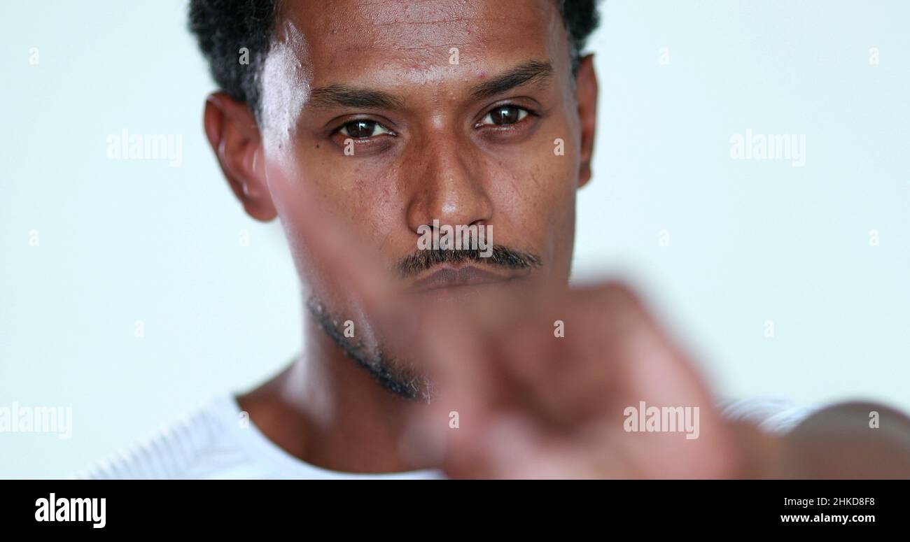 Upset African man shaking finger rejecting offer. Man disapproving with ...