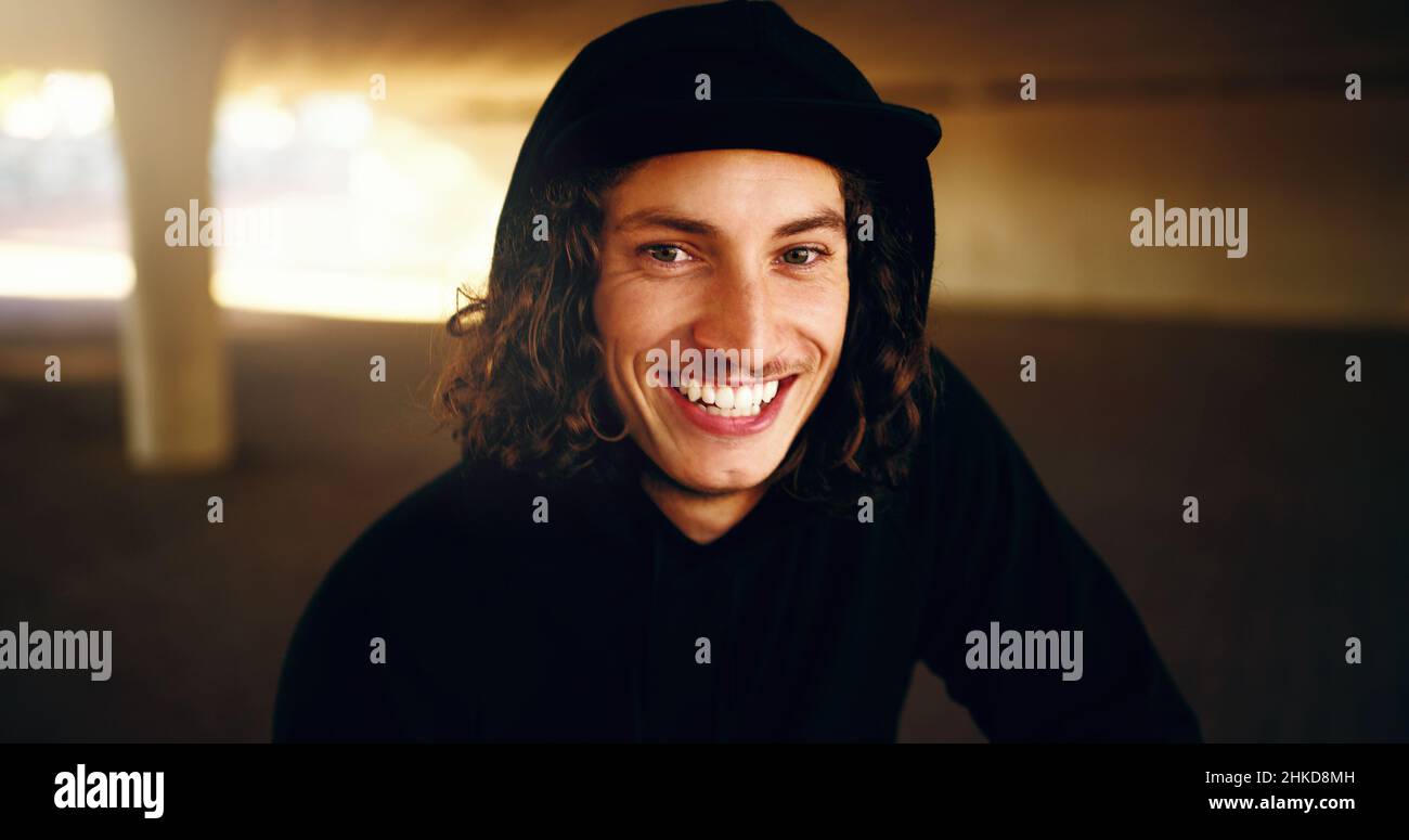 Enjoying life. Cropped portrait of a young man chilling outside in an ...