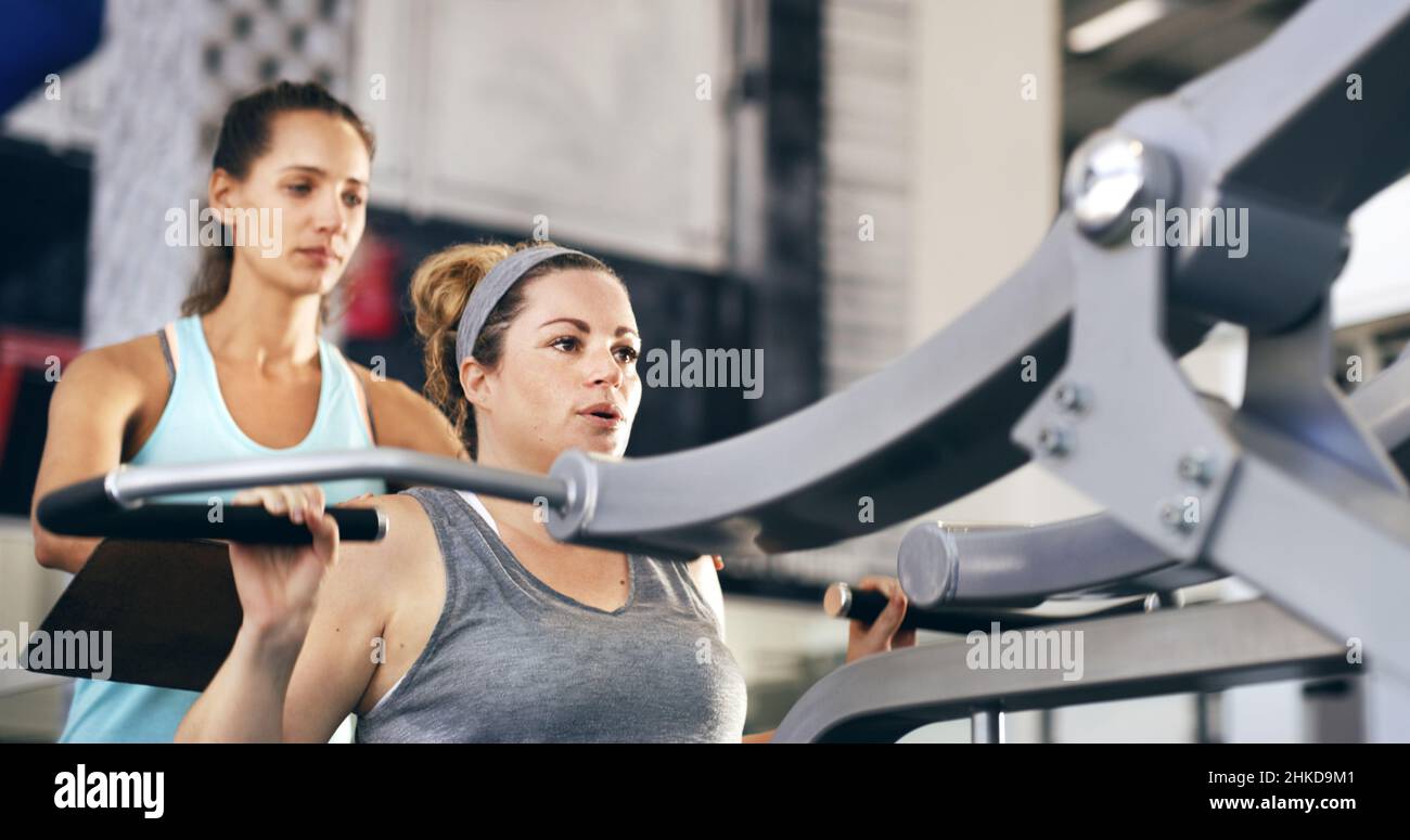 Lets begin.... Cropped shot of a female fitness instructor taking her ...
