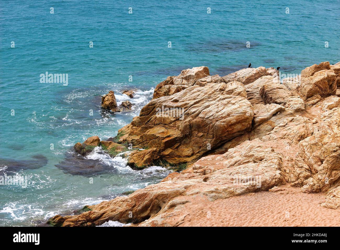 The tourist town of Calella with its beautiful coves, its beaches and ...