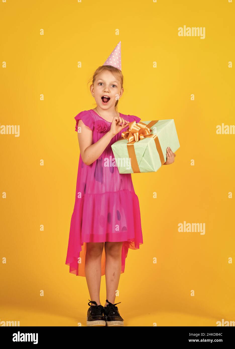 big surprise. kid holding gift package. holiday preparation and ...