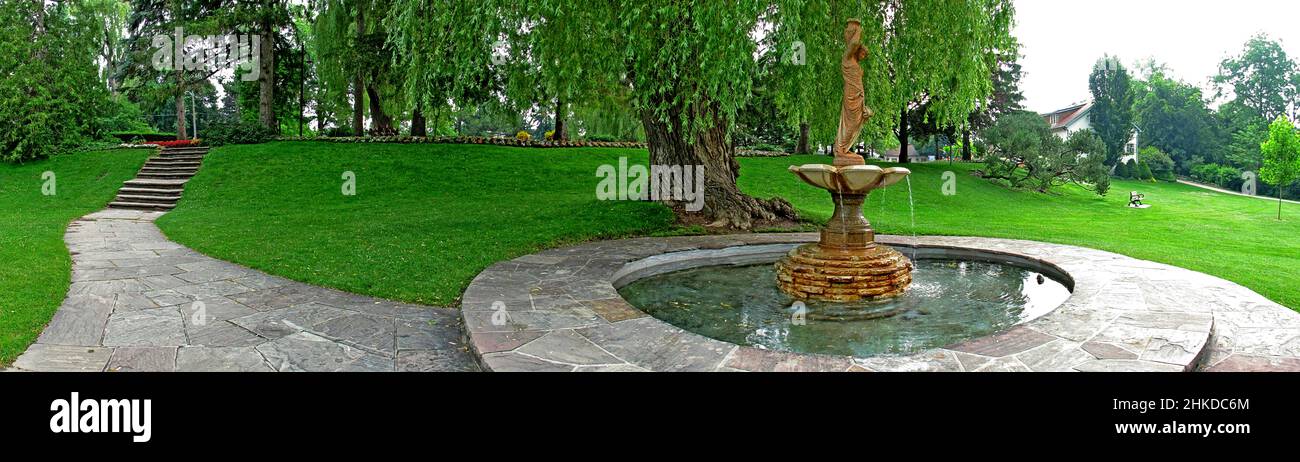 Panoramic view of public park with water fountain. Panoramic image ...