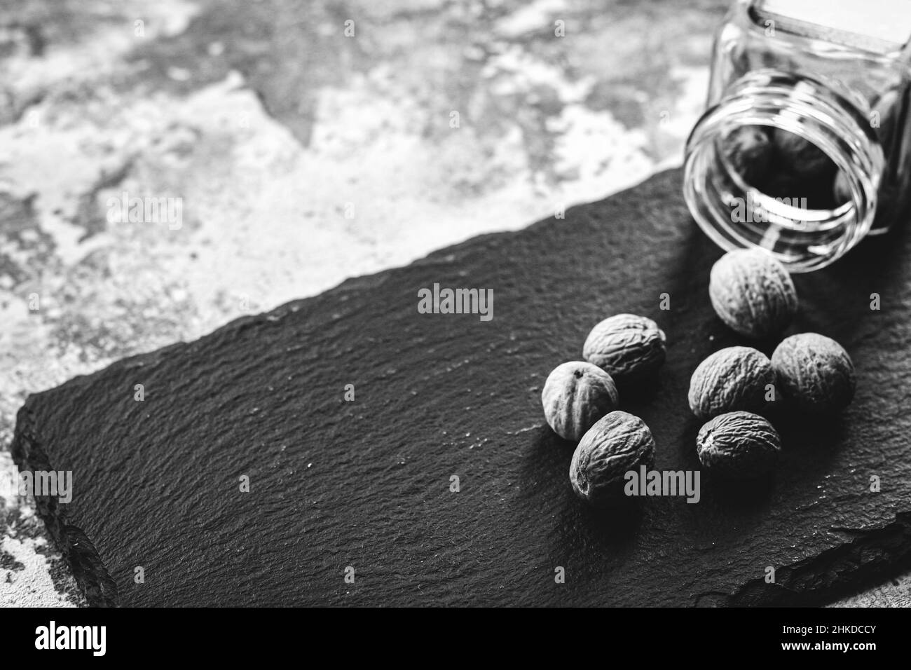 Black and white whole nutmeg spice Stock Photo - Alamy