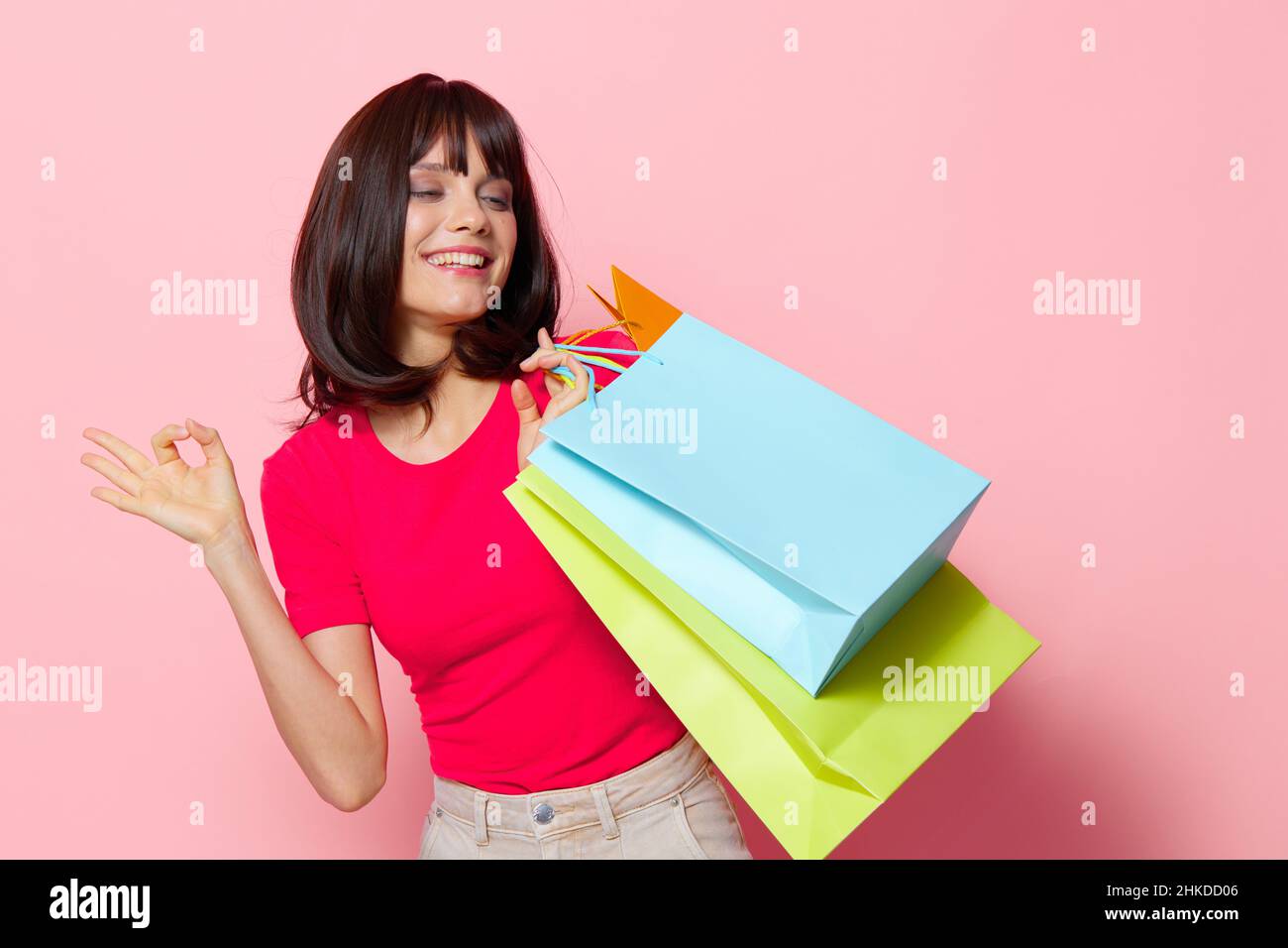 young woman shopping emotions posing joy isolated background Stock ...