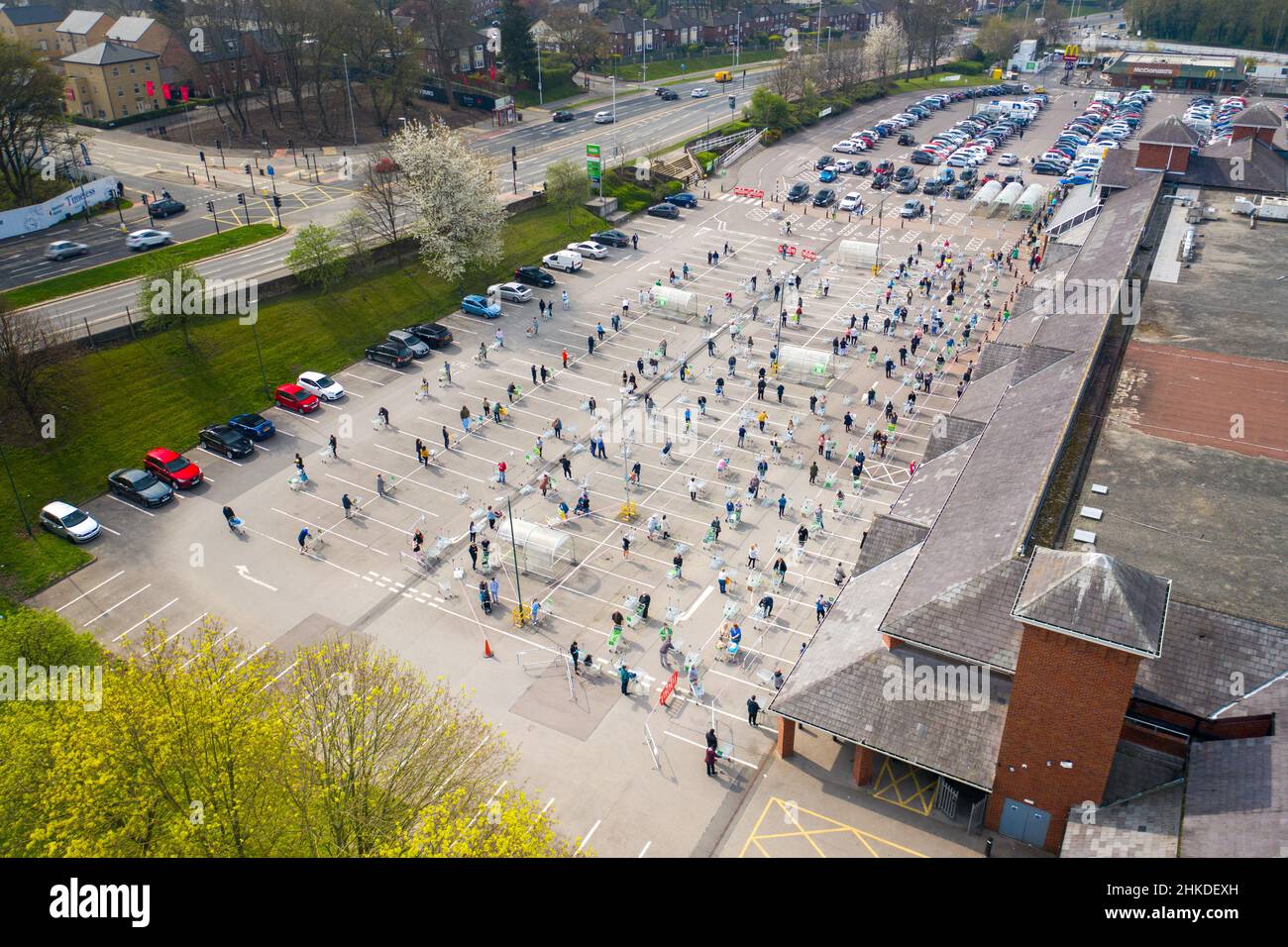 People in the UK queuing following social distancing rules to go inside ...