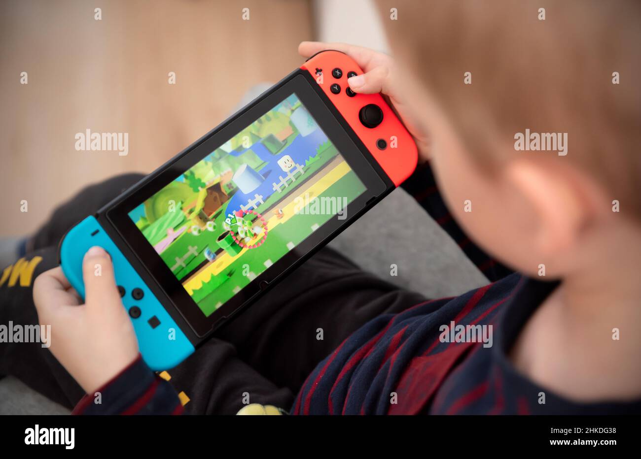 Wroclaw, Poland - JAN 27, 2022: Boy plays Nintendo Switch console ...