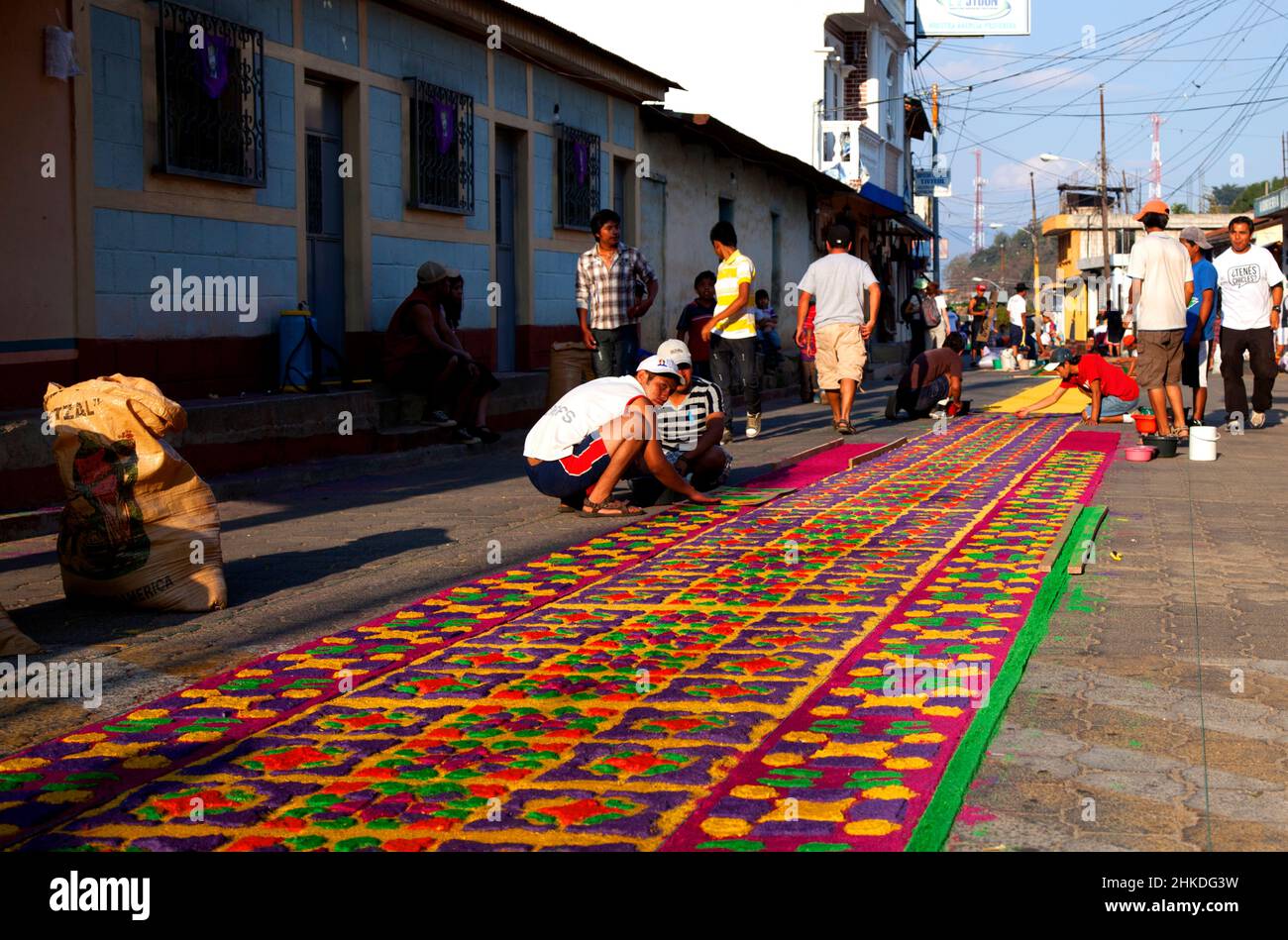 Street screen of locals producing alfombra, sawdust carpets with ...