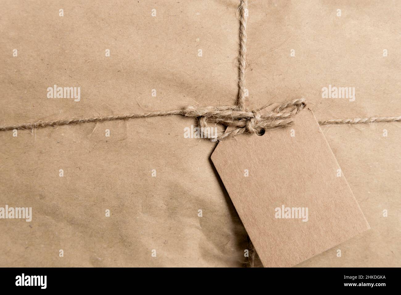 Sealed package in paper and tied with thread and blank sticker for a ...