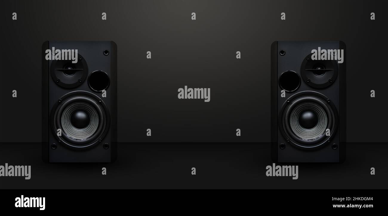Black audio speaker on dark background mock up music poster copy space ...