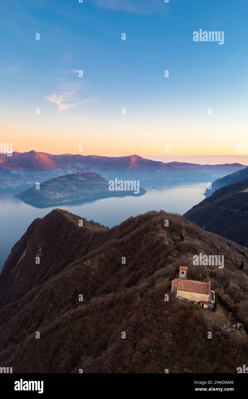 Aerial view of the Santuario della Santissima on Lake Iseo at sunset ...