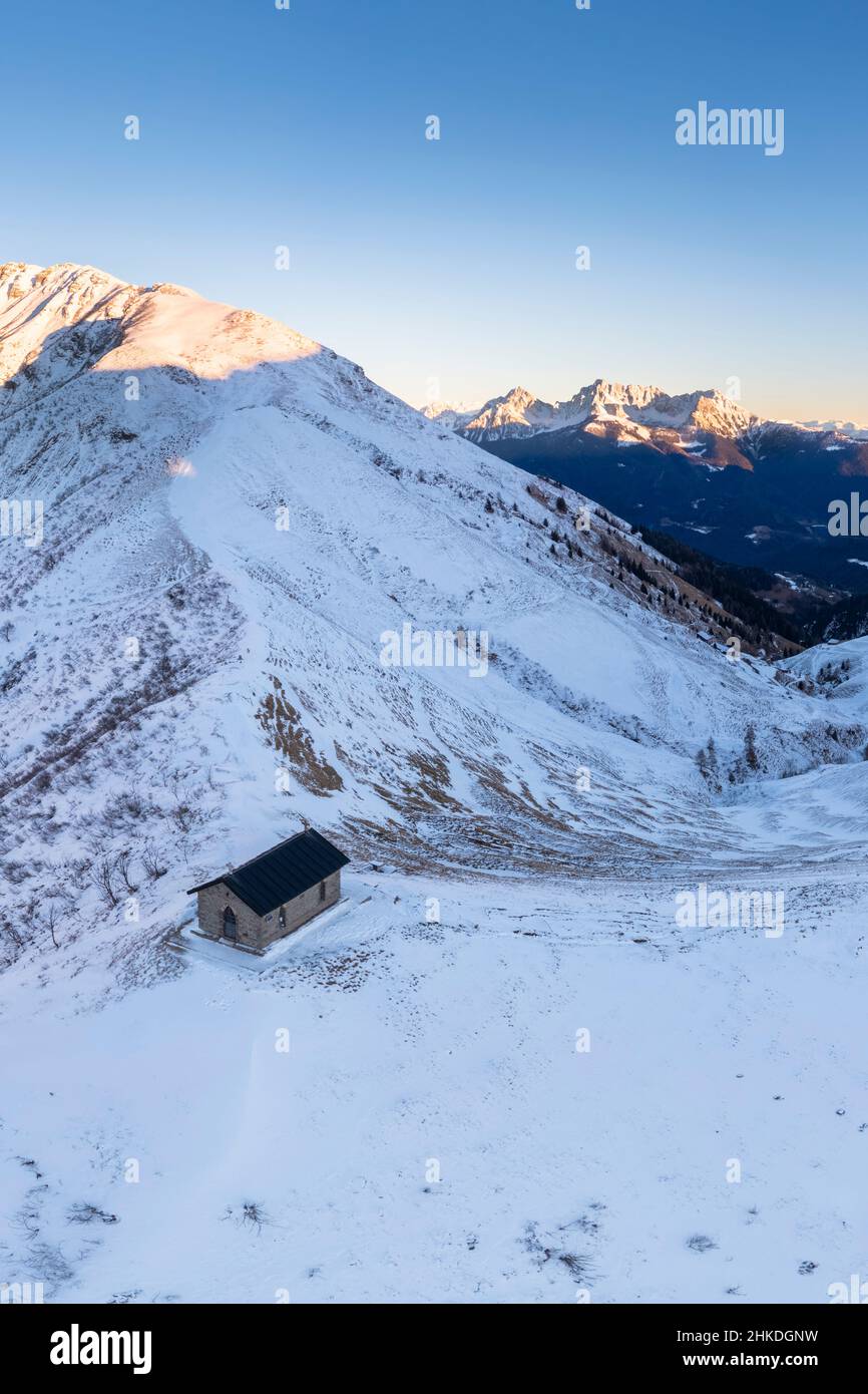 Aerial view of the small church at the top of the Manina Pass in winter ...