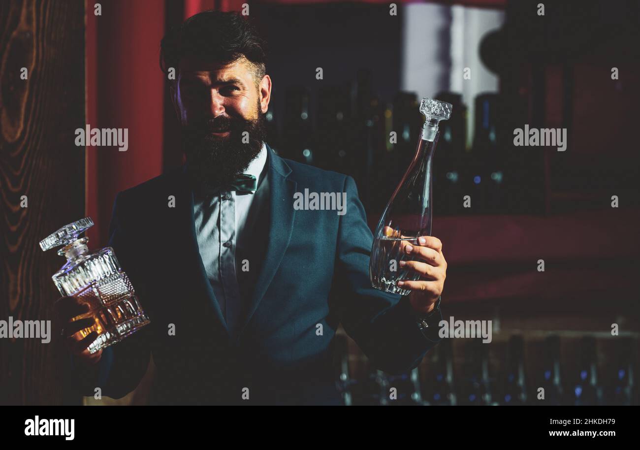 Handsome bearded barman with long beard and mustache with serious face ...