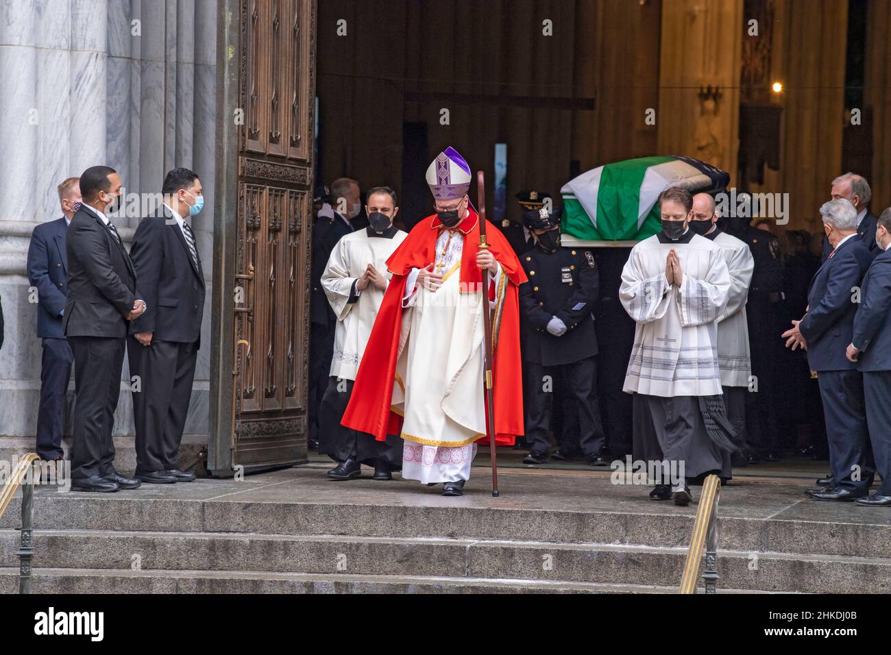 Cardinal Timothy Dolan leads the casket of fallen NYPD officer Wilbert ...