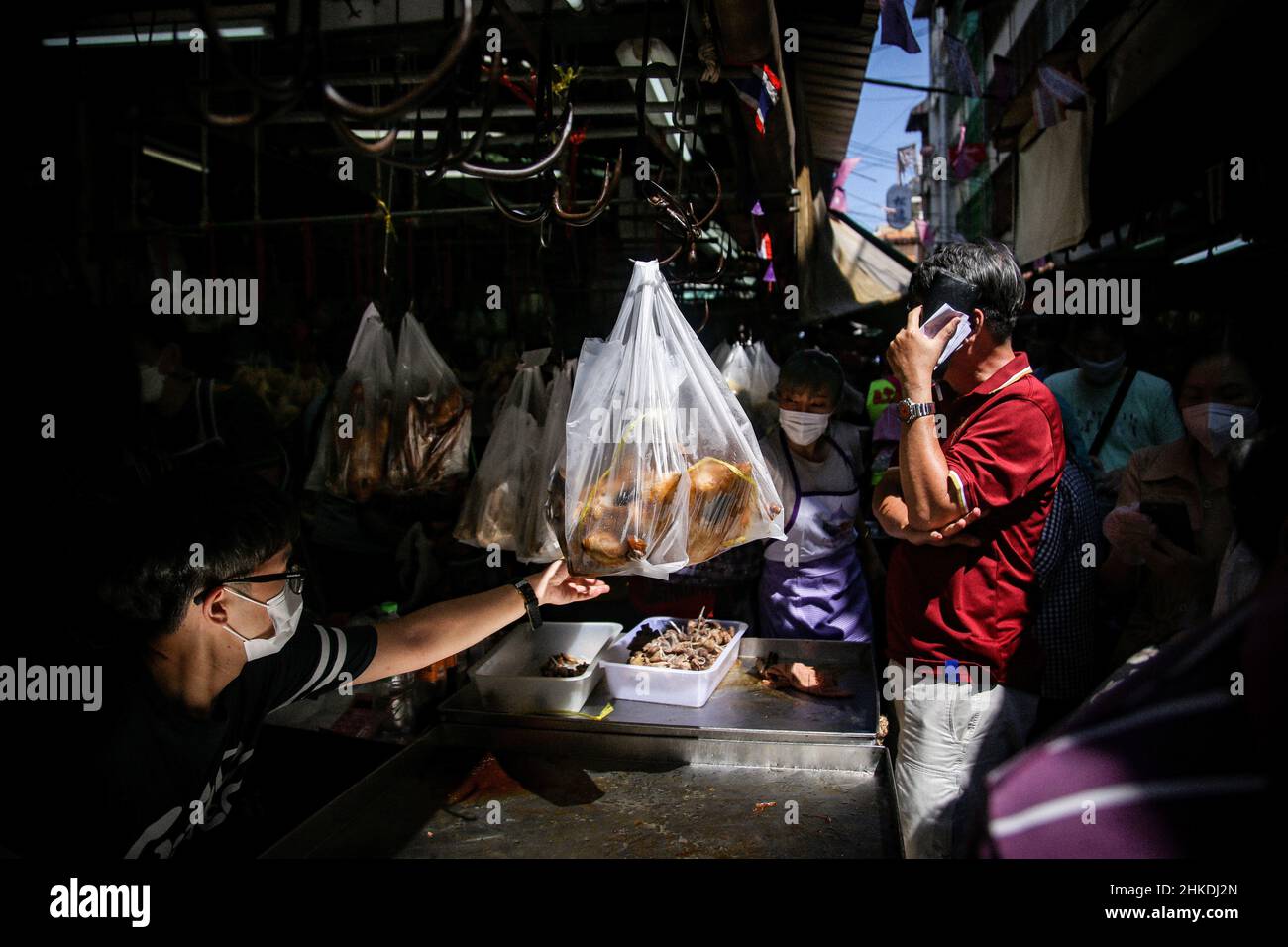 People buying deep fried Soya ducks for the Chinese New Year ceremonies ...