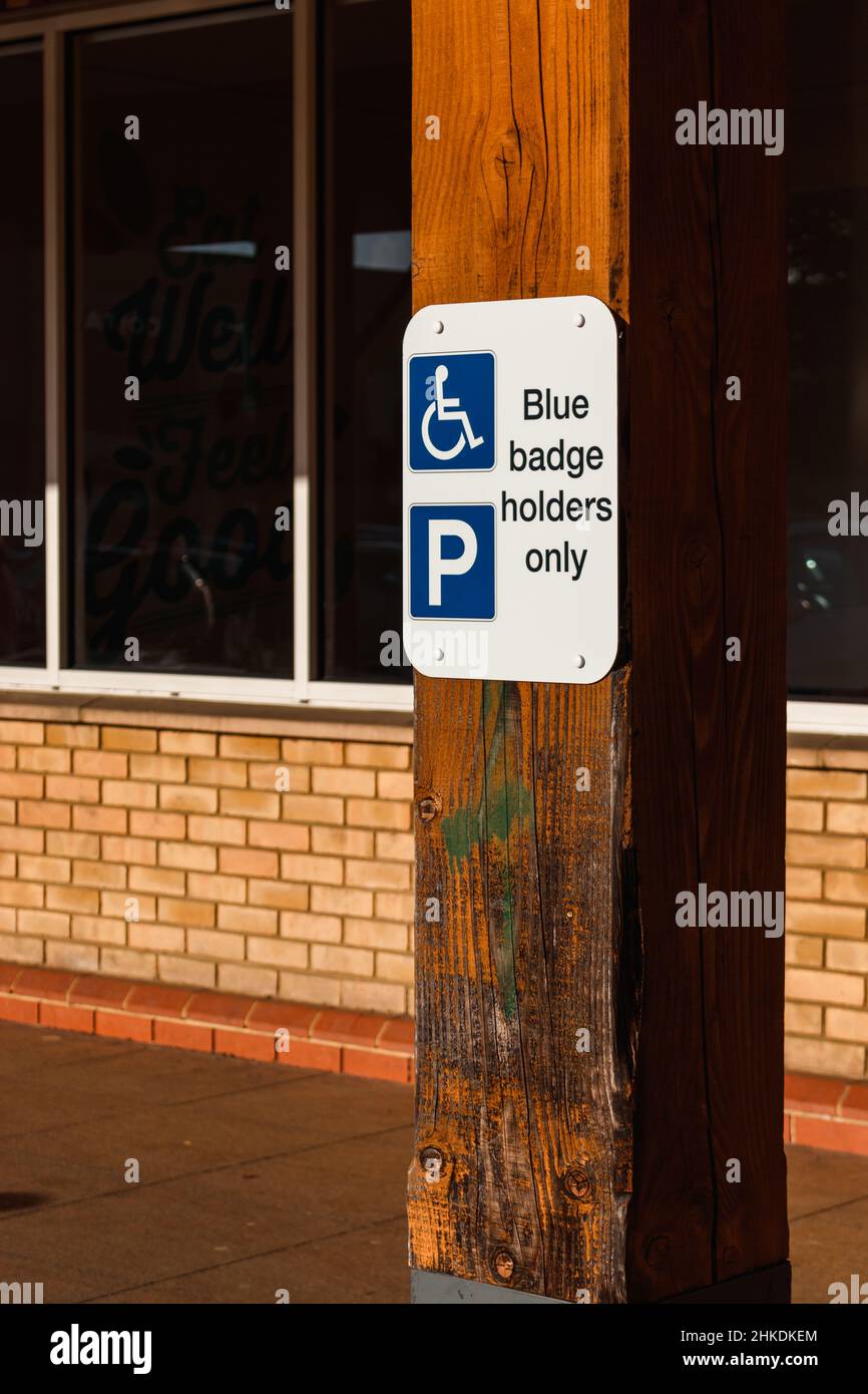 Blue badge sign. Disabled parking space sign Stock Photo - Alamy