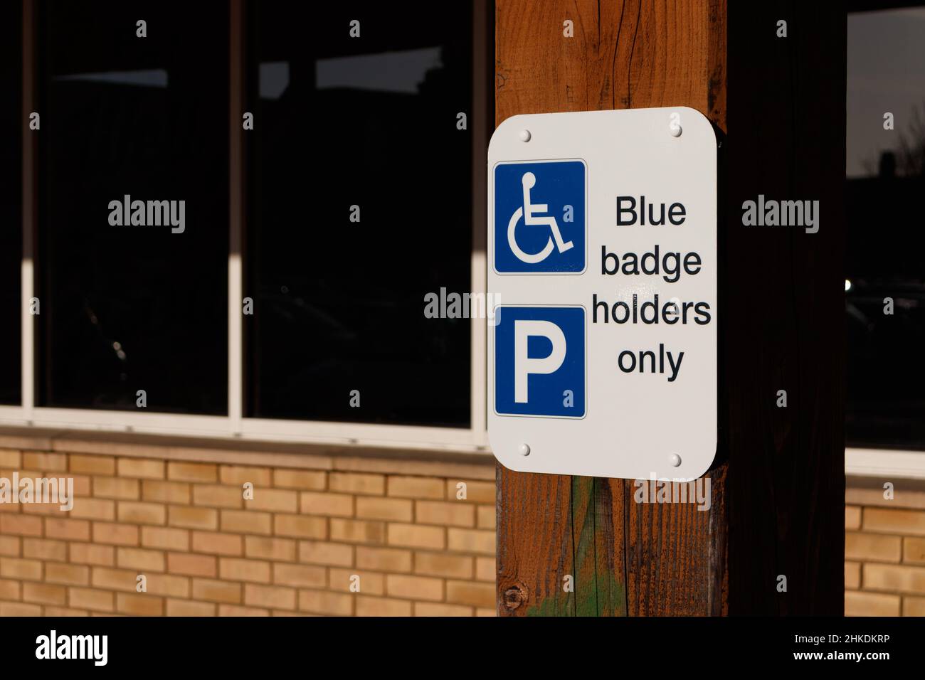 Blue badge sign. Disabled parking space sign Stock Photo - Alamy