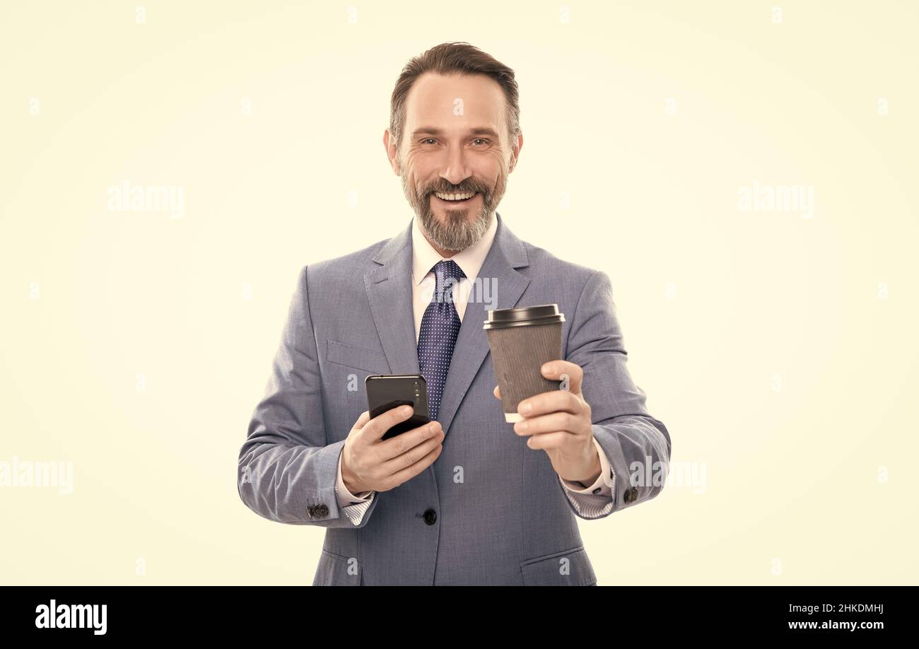 happy mature ceo in suit chatting on phone and drink coffee isolated on ...